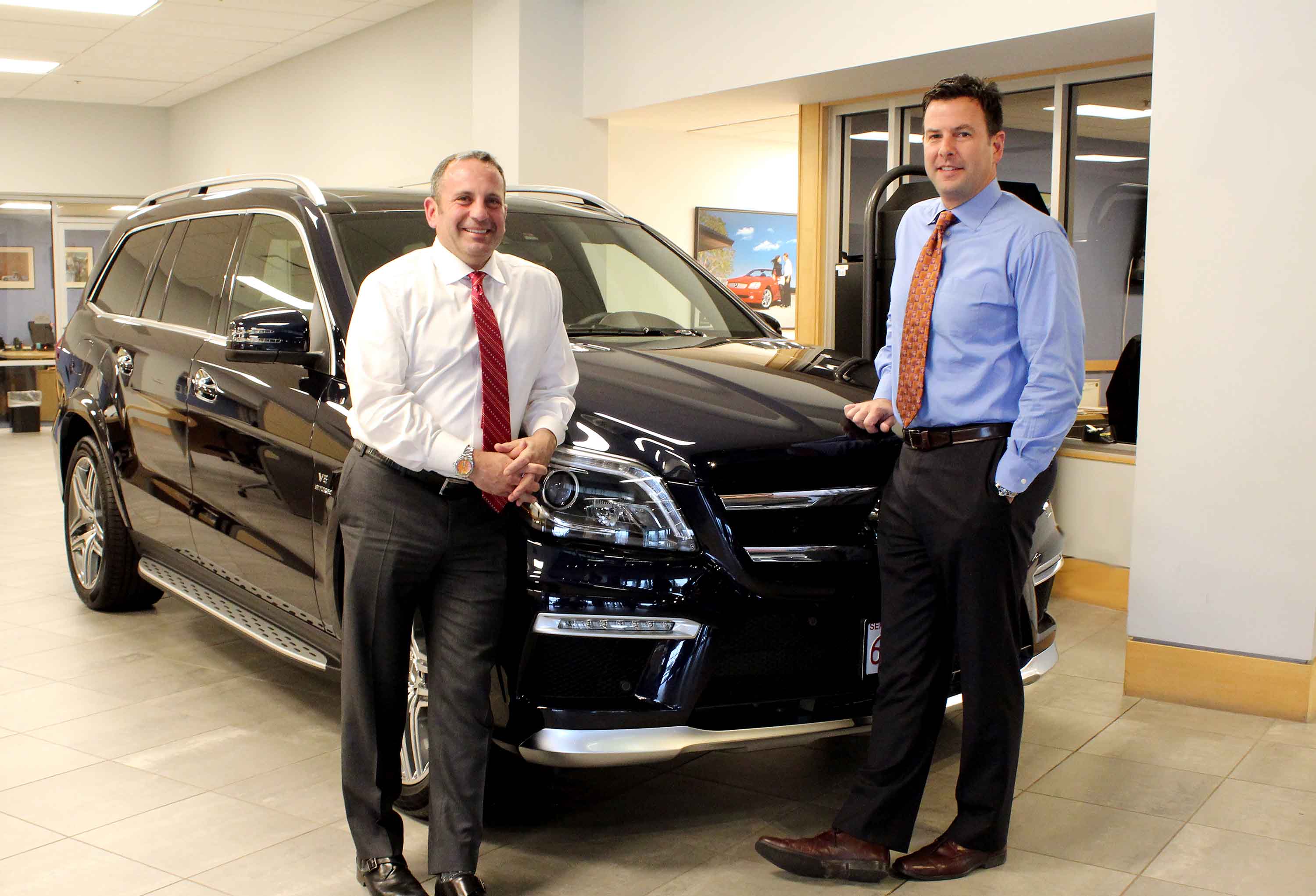 Auto dealer decides to adjust his upside-down billboards - The Boston Globe