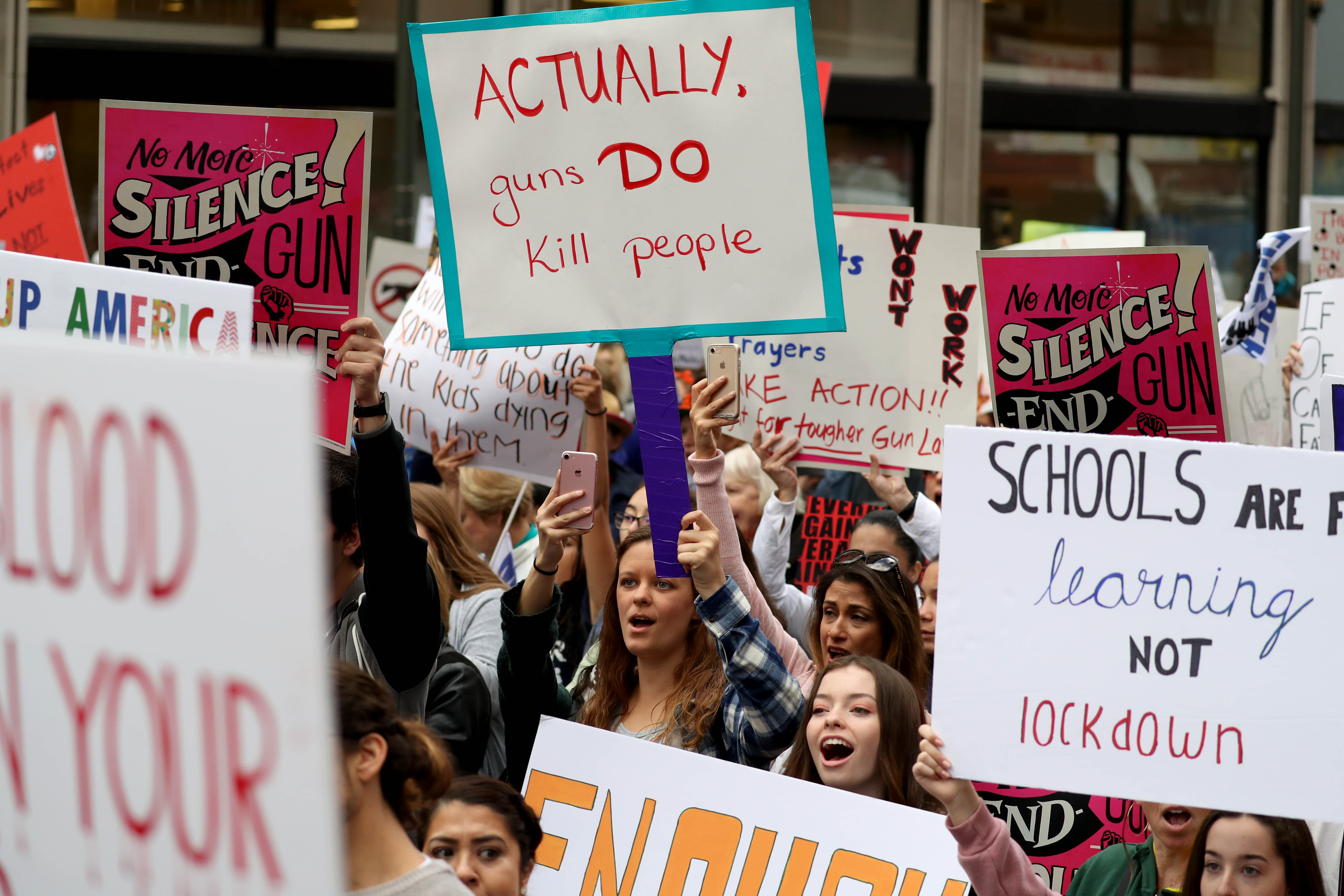 ‘Guns don’t kill people, umm . . . yes they do’ and more protest signs ...