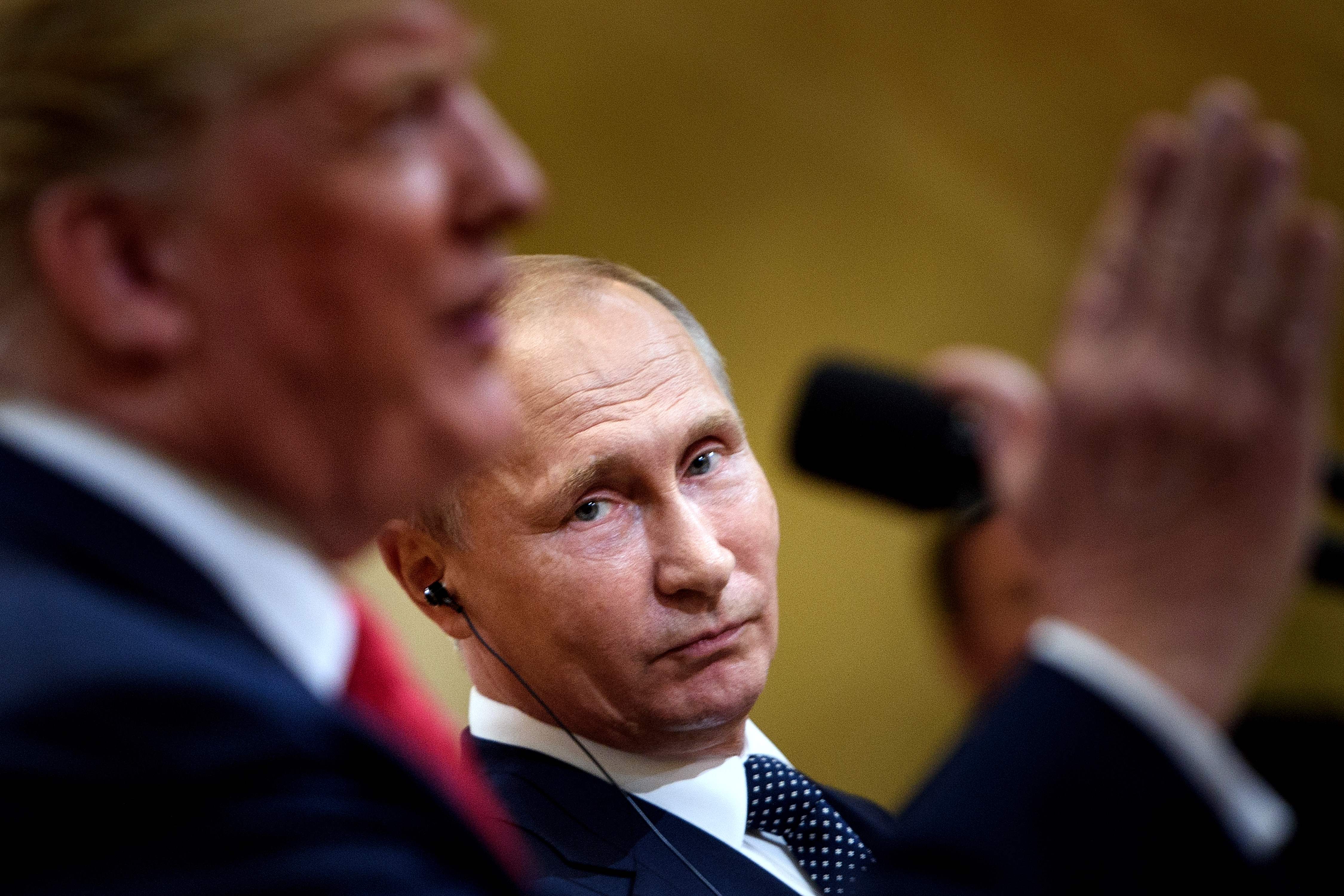 Putin pets his poodle at the Helsinki summit - The Boston Globe