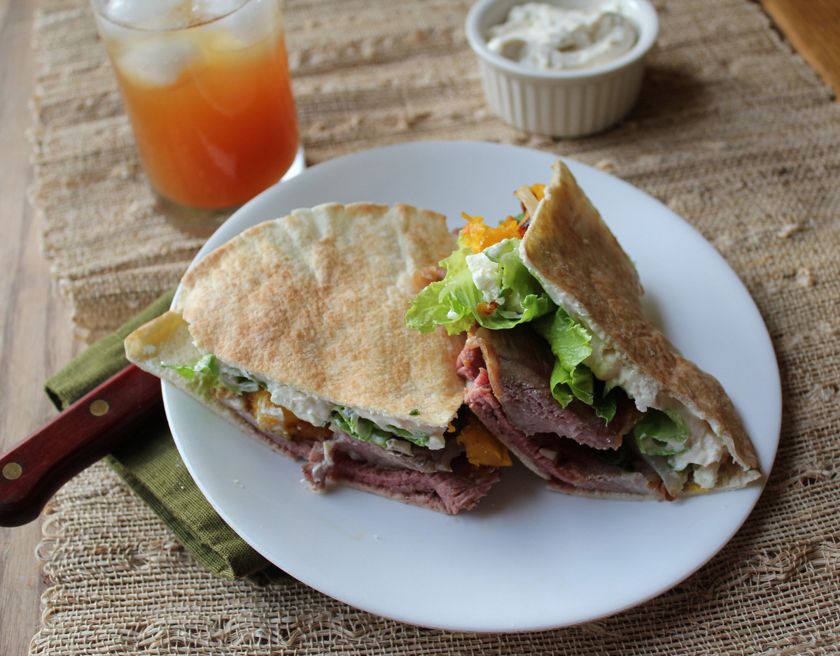 Pita pockets with lamb, roast vegetables, feta, and lemon-tahini ...